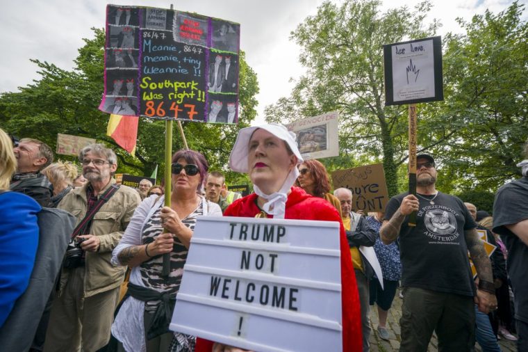 Protests in Scotland as Trump begins five-day visit with game of golf