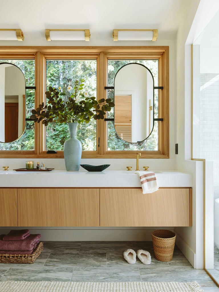 8 Bathroom Mirror Workarounds for When There’s a Window in Your Way