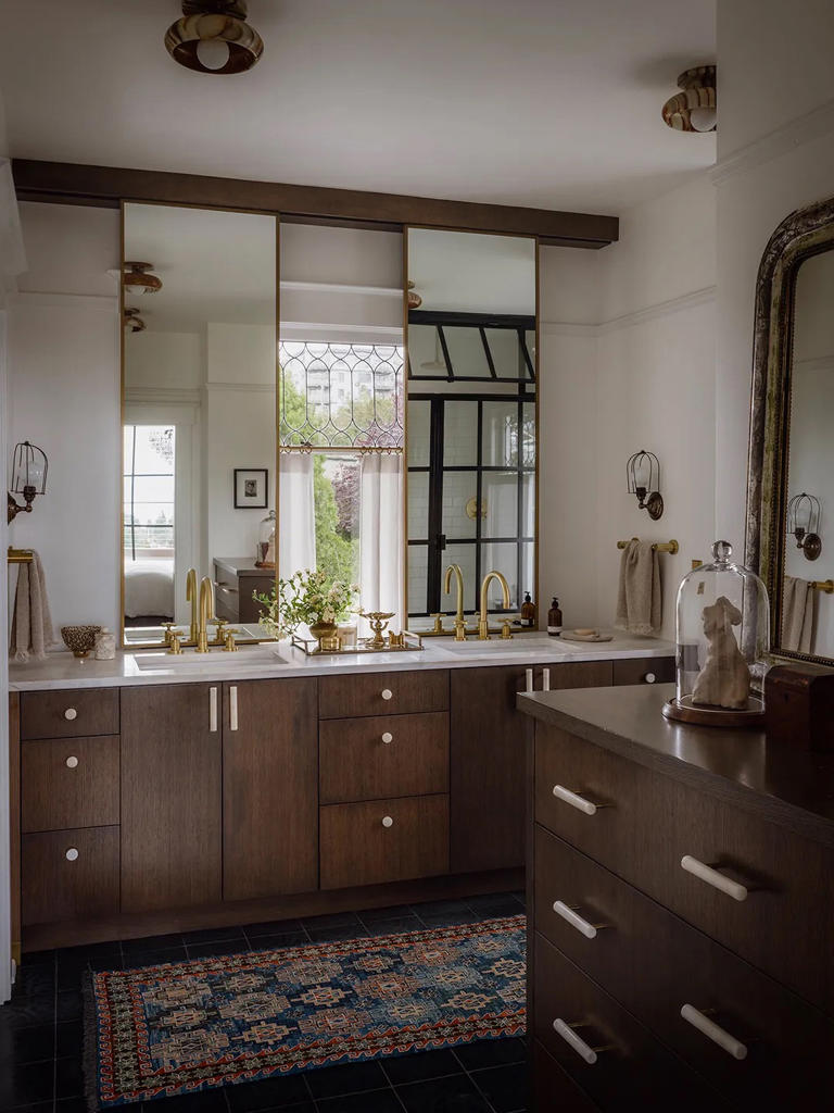8 Bathroom Mirror Workarounds for When There’s a Window in Your Way