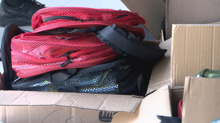 Organizations around the community give out backpacks ahead of school year