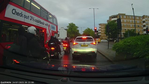 Reckless mopeds cause havoc as they jump red lights and almost hit ...