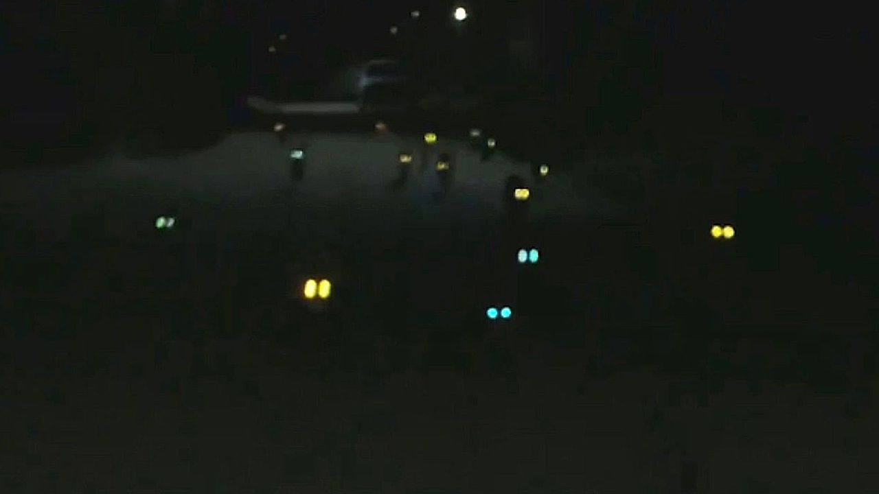 Frightening sight: Dozens of spooky glowing eyes appear from the shadows