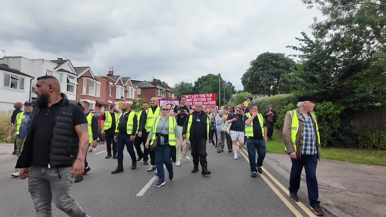 A young couple in a car wanting to drive out before the Stand Up To ...