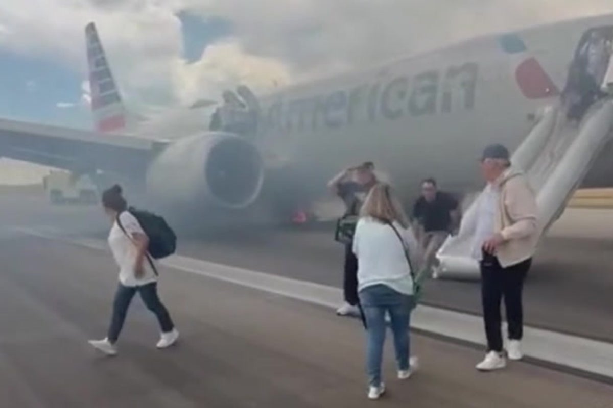 American Airlines passengers flee on emergency slide after Boeing plane ...