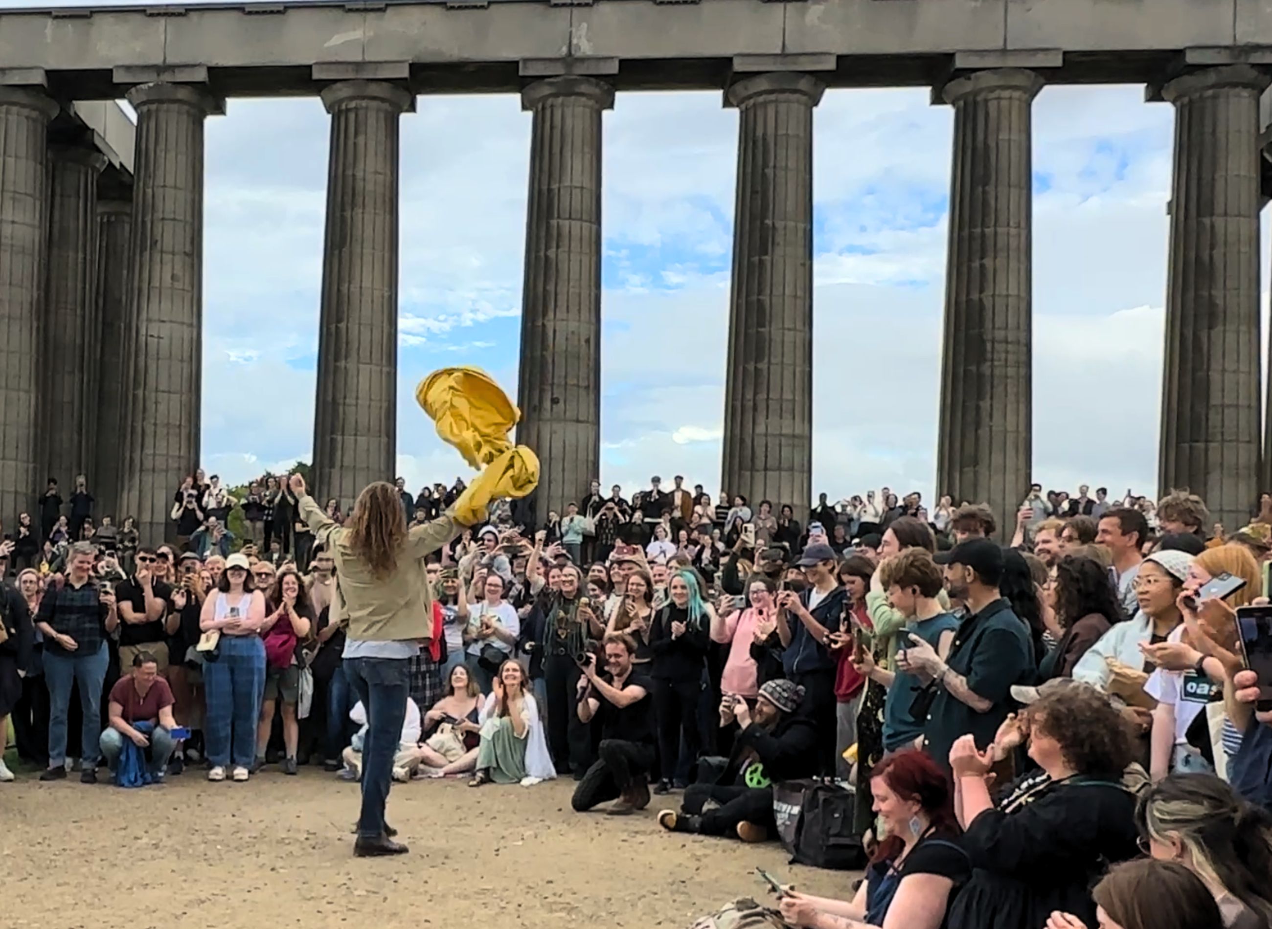 Hundreds of people gather on Edinburgh's Calton Hill to watch man fold ...