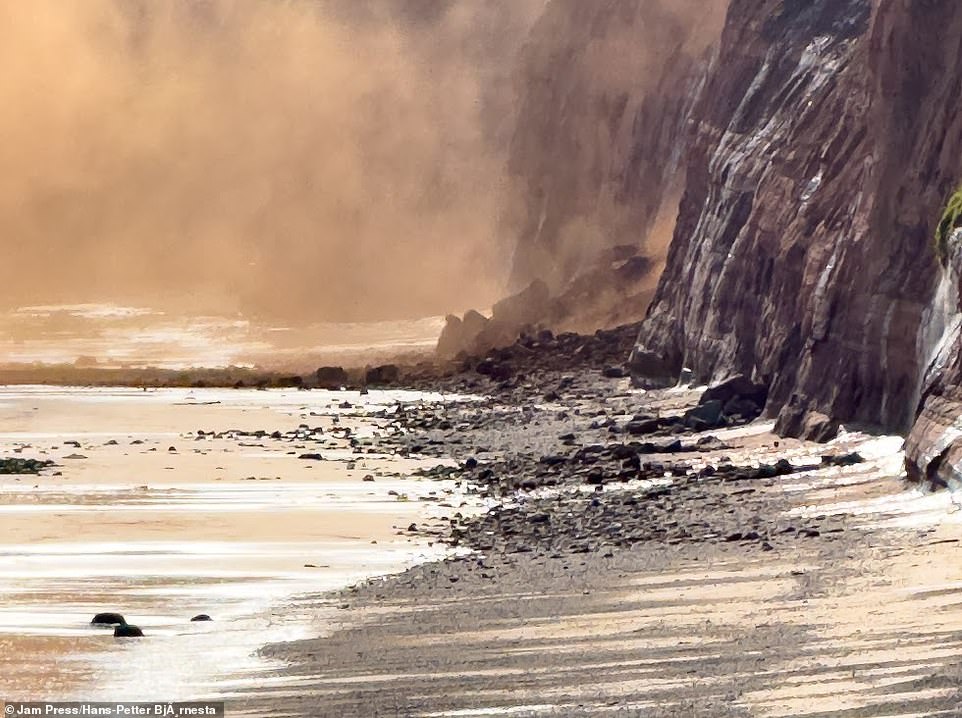 Rockfall crashes onto Devon beach, nearly hitting sunbathers
