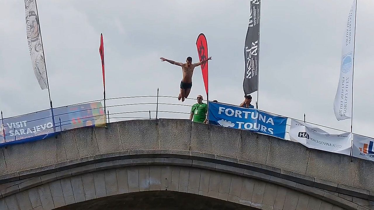 Athletes gather for annual high dive from historic Mostar Bridge in ...