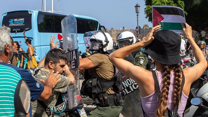 Riot police scuffle with demonstrators on Rhodes during visit by ...