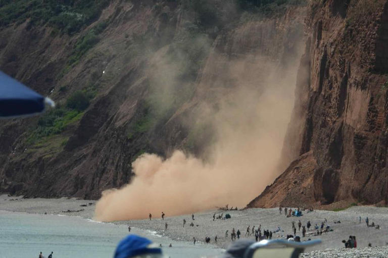 Sunbathers left stranded after cliff comes crashing on Devon beach