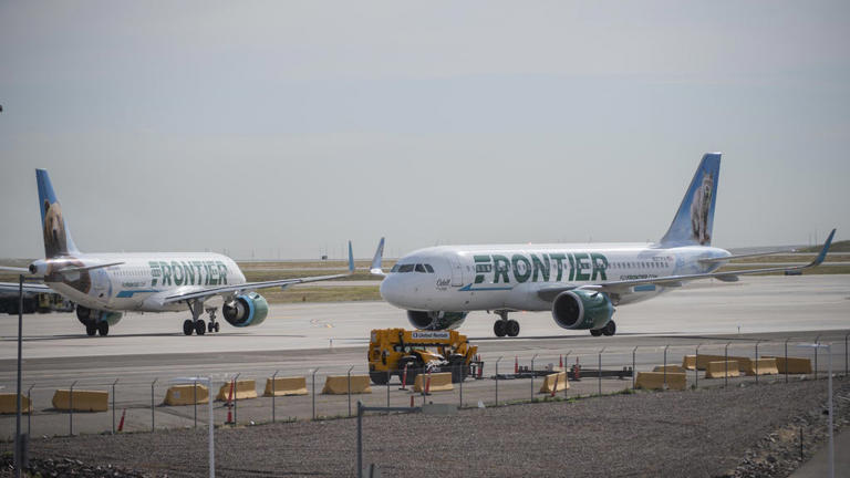 Frontier Airlines plane at Denver International Airport evacuated ...
