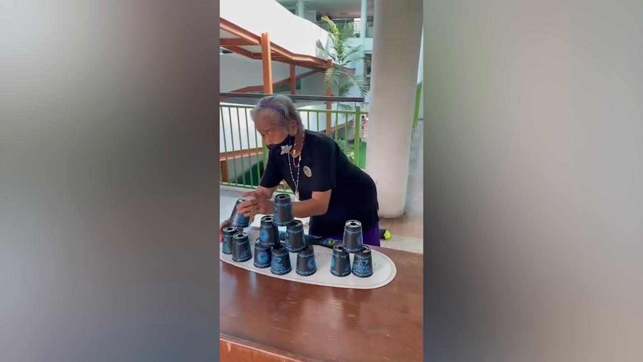 Nursing home teaches pensioner Speed Stacks game to help improve brain ...