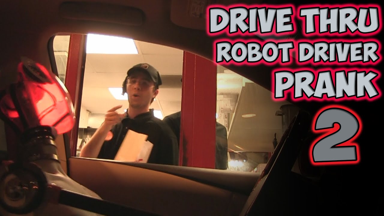 Watch drive-thru workers get stunned by a robot behind the wheel (part 2)