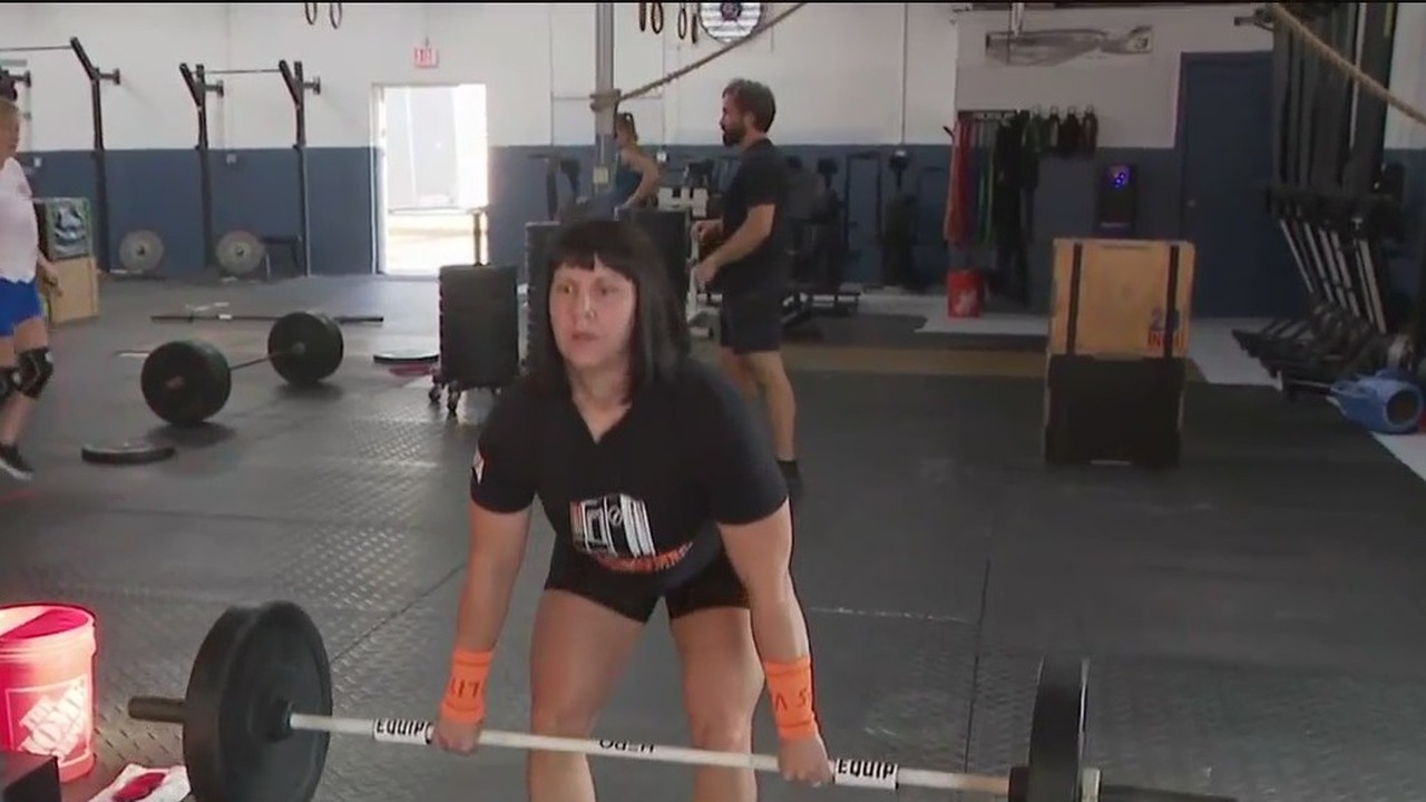 2 athletes prepare to compete in adaptive Crossfit games