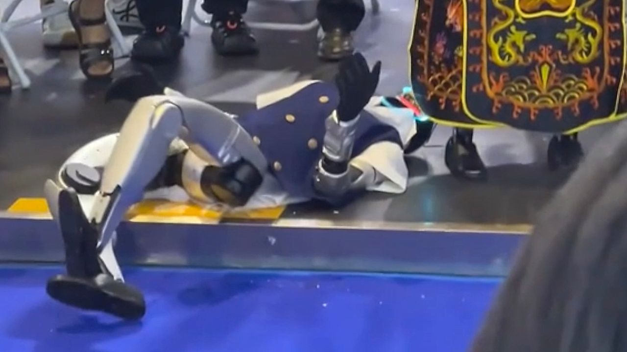 Groove glitch: dancing robot takes a tumble at Shanghai tech show