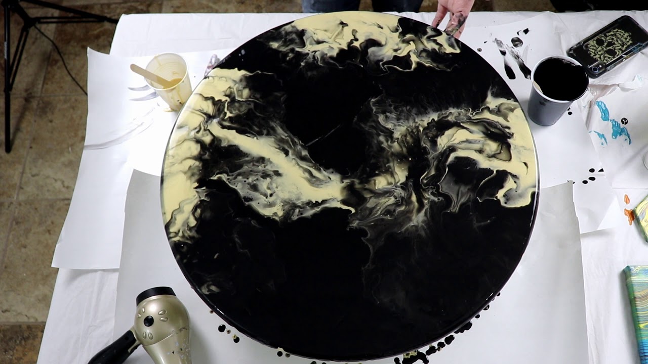 Simple Black and Gold Dutch Pour With Negative Space Design