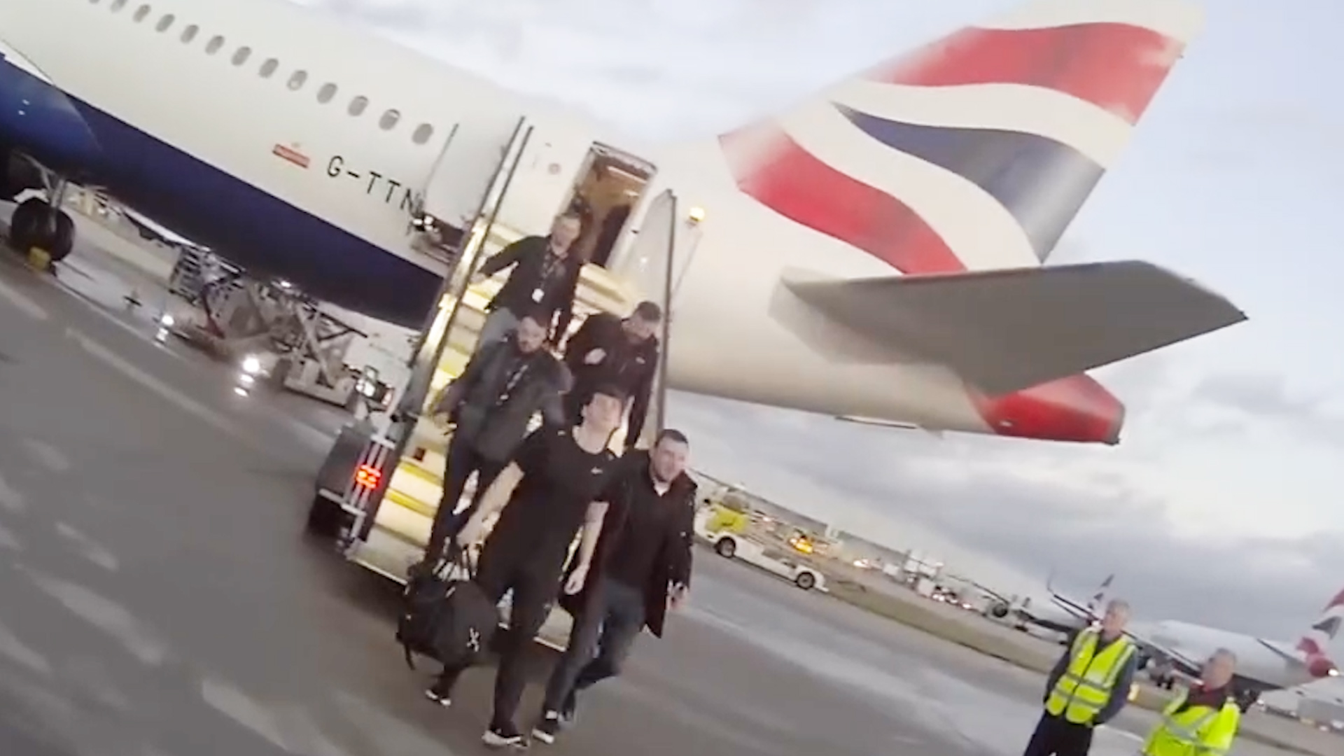 Killer caught and escorted off plane after 18-month manhunt