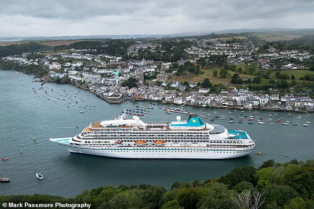 Locals hit out at 'disgusting' massive cruise ships they say are swamping Cornish town with tourists