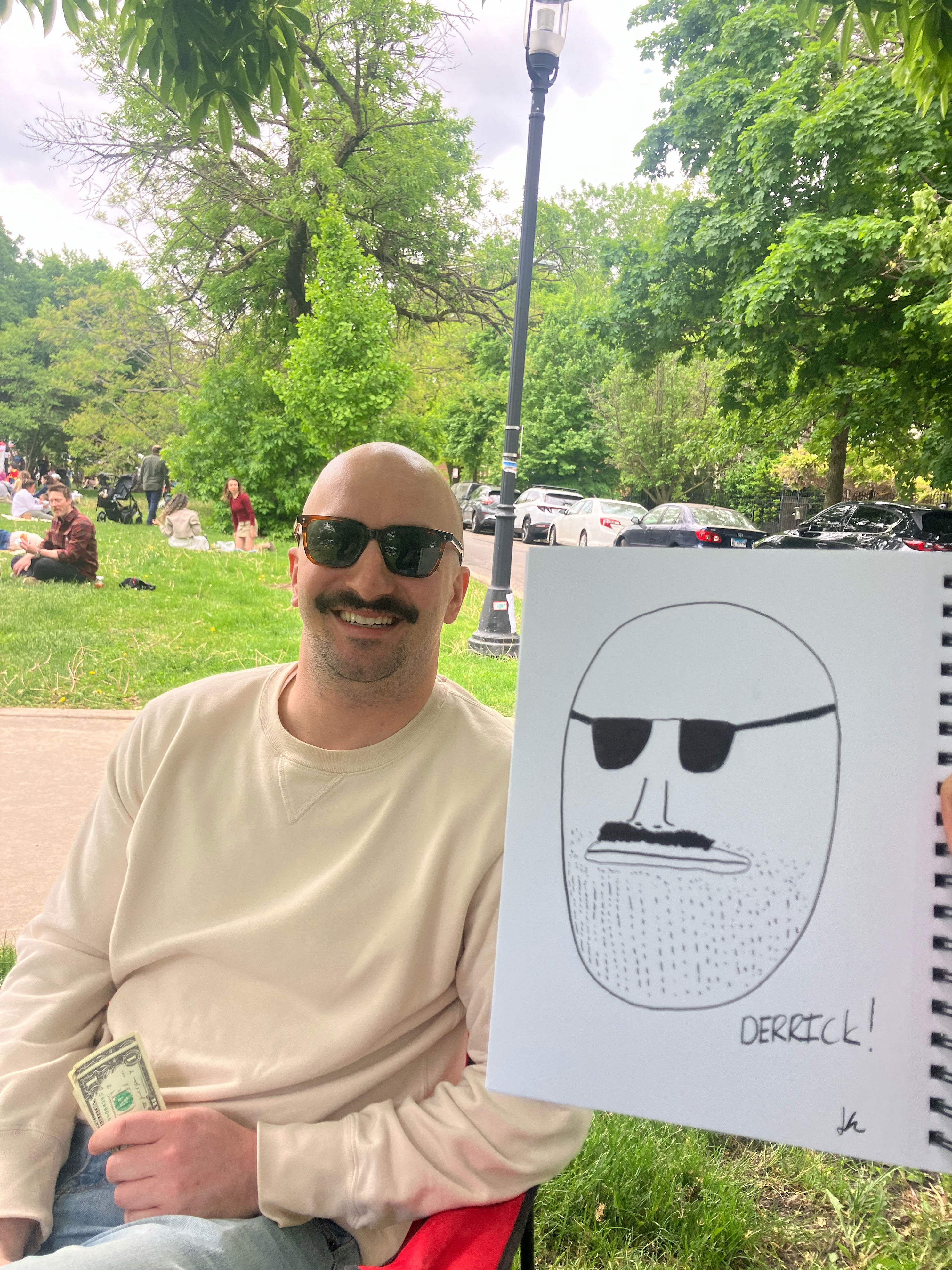 For $5, this man will draw a terrible portrait of you