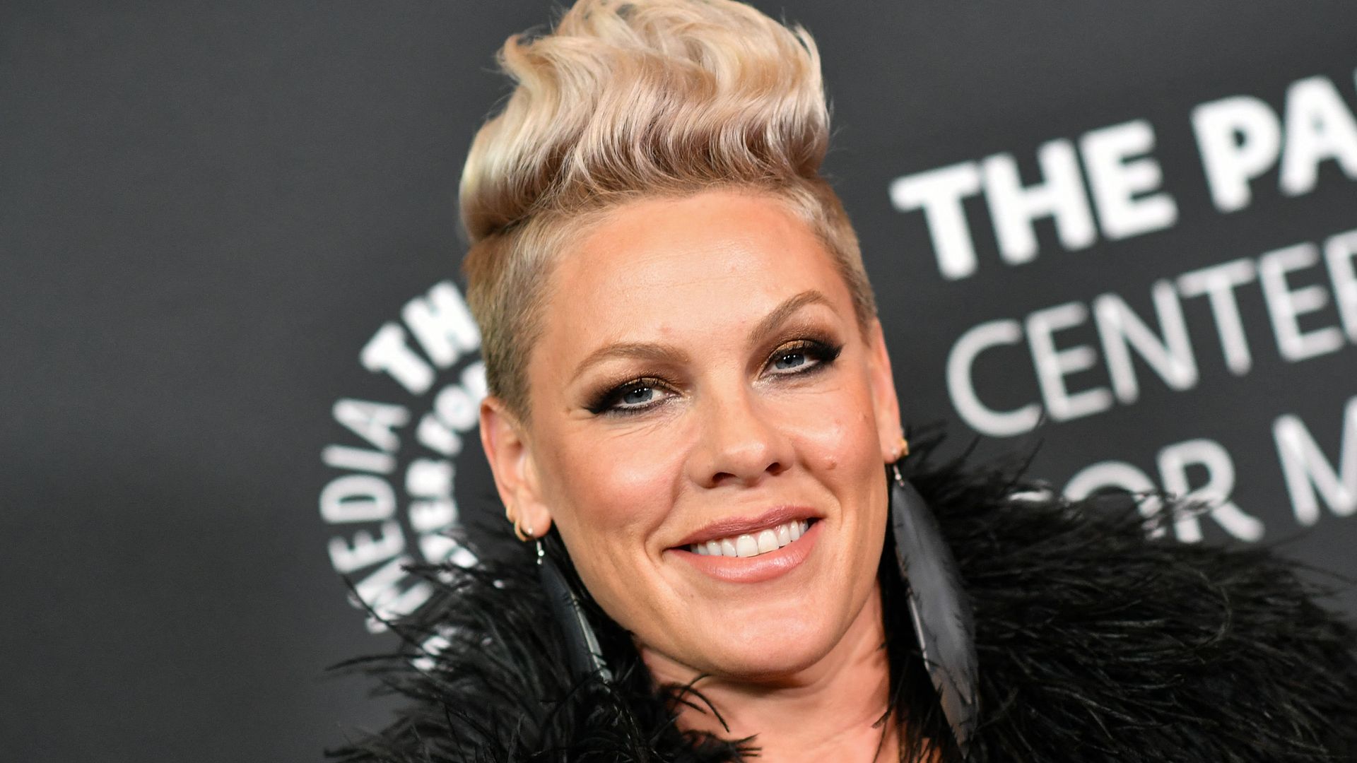 Pink's teen blonde daughter is as tall as the singer is in new family photo