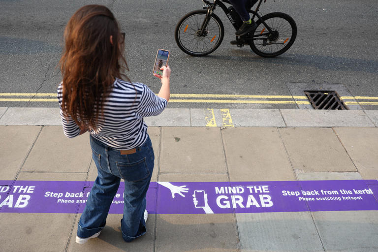 Purple pavement markings part of Mind the Grab campaign to tackle phone ...
