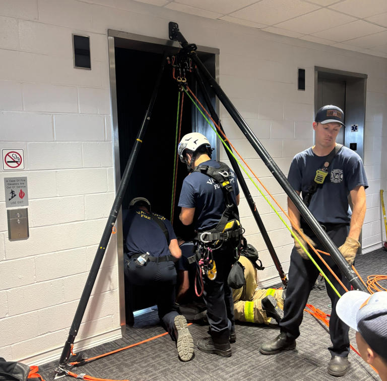 VB firefighters rappel elevator shaft, rescue trapped woman