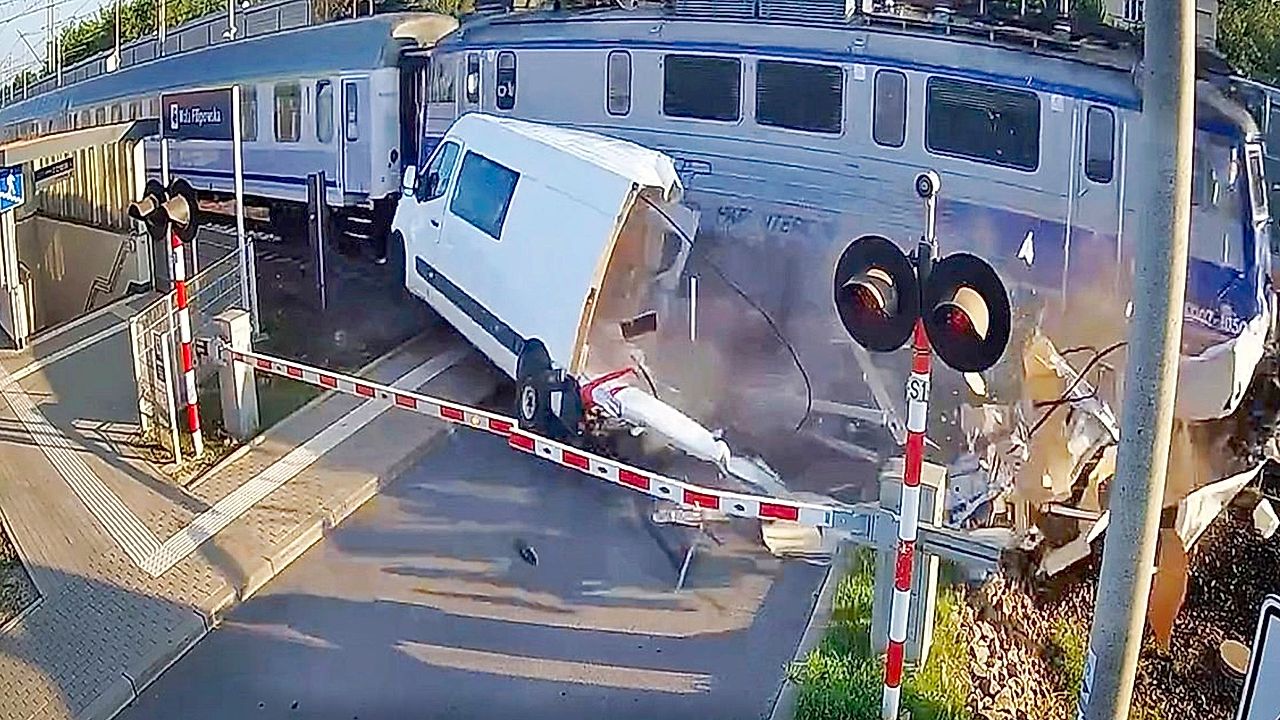 Van driver cheats death after vehicle stuck on crossing obliterated by ...