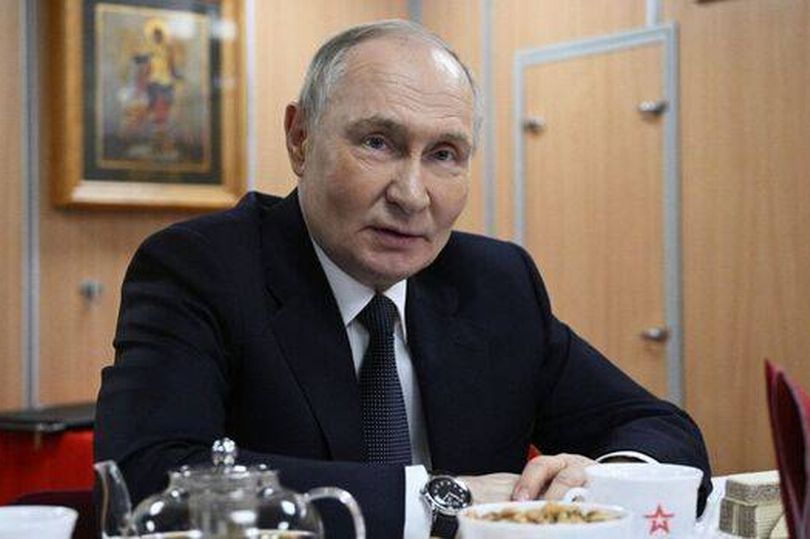 Vladimir Putin covers face in layers of make-up as he appears after ...