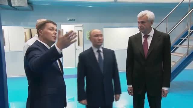 Putin stops off at fish factory on way to Alaska for crunch Trump meeting