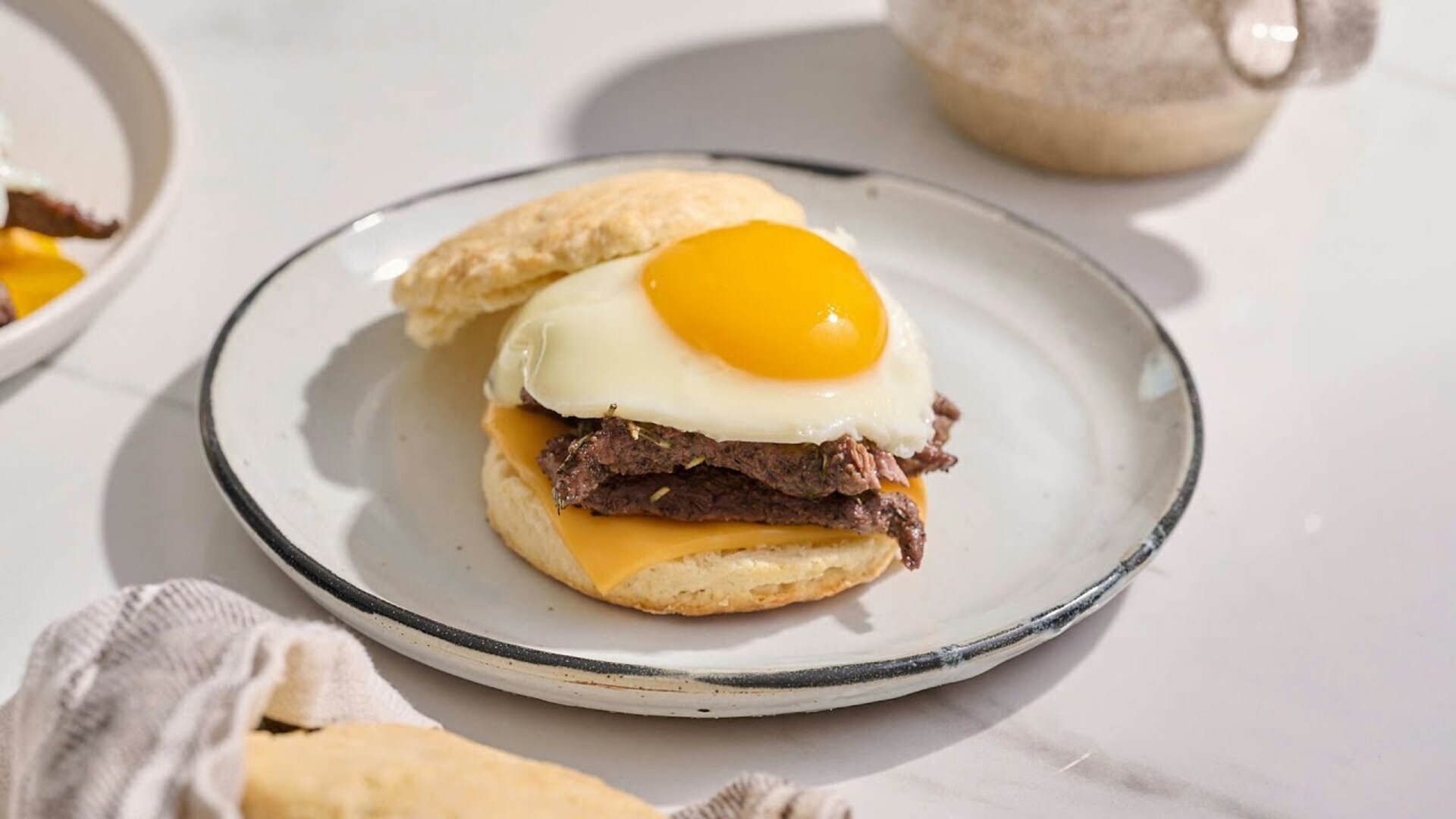 This Steak And Cheese Biscuit Recipe Brings Extra Comfort To Brunch
