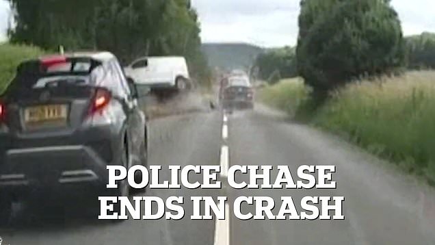 Moment driver in stolen car crashes into police van during cop chase