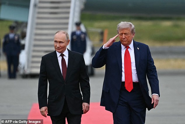 'I can't hear you!' Putin points to his ear when reporter asks if he'll ...