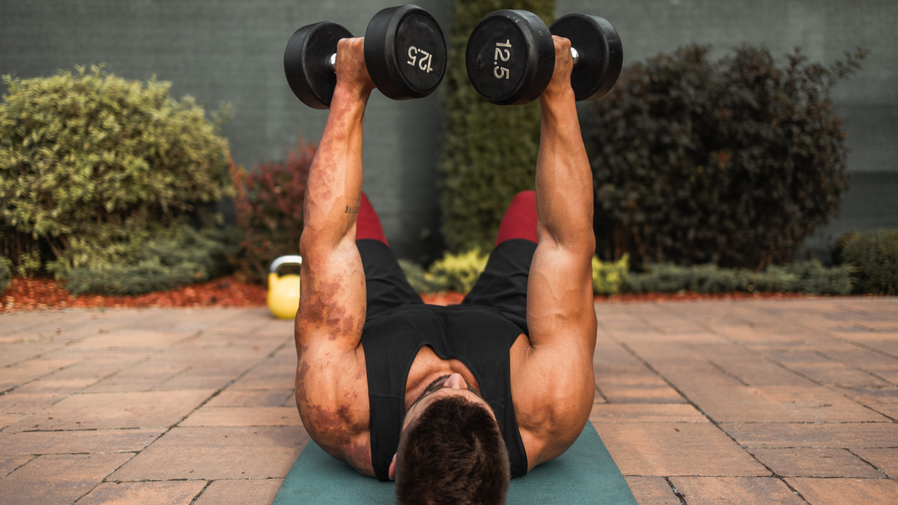 This no-bench 30-minute dumbbell workout packs on upper body muscle at home