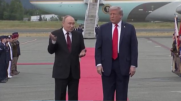 'I can't hear you!' Putin points to his ear when reporter asks if he'll ...