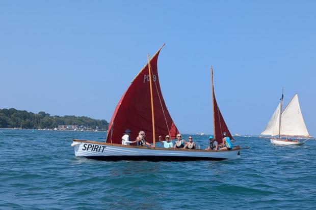 Beautiful sight as pilot gig boats sail off the Isle of Wight