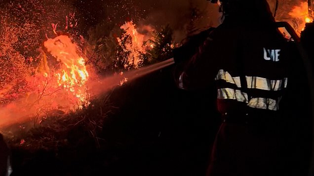 Firefighters battle advancing fire front in Spain's Galicia
