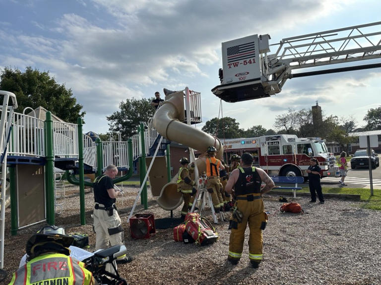 First responders in Connecticut rescue man stuck in playground slide ...