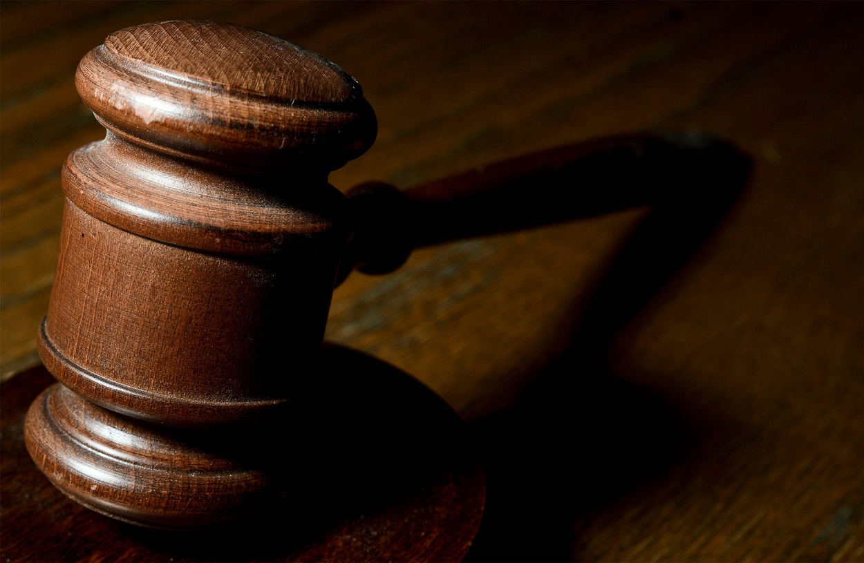 Woman Pleads Guilty to Charges After Spitting Incident