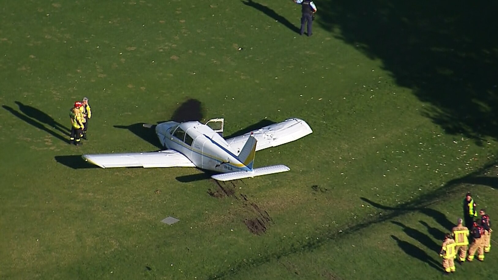 Two people escape serious injury after light plane crash lands on golf ...
