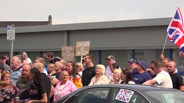 Angry protestors clash with anti-migrant demonstrators in Scotland