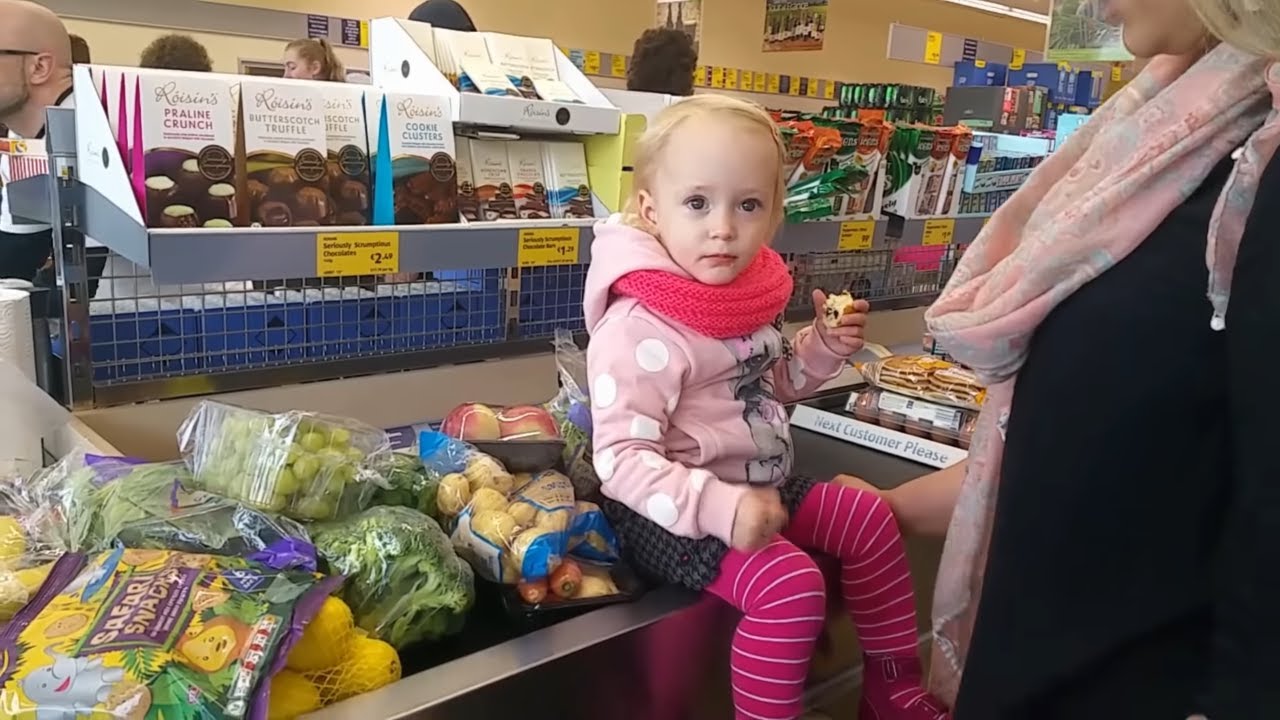 Little girl serves dog friend like a tiny master chef