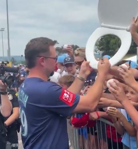 Mariners’ Cal Raleigh signs bathroom item, dons custom chest protector ...