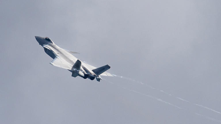 J-20 Top Speed: How Fast Is China's Jet Compared To The F-22 Raptor?