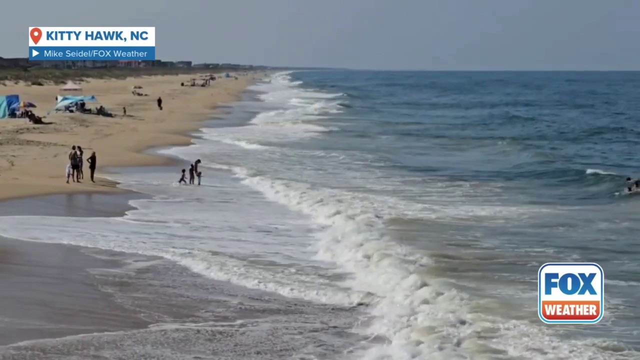 Watch: Beachgoers in North Carolina enjoy sun, sand ahead of Hurricane ...