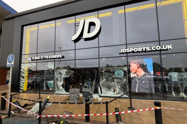 Pictures show front of store smashed in overnight at retail park