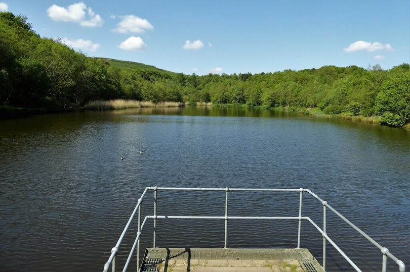Body found in reservoir after woman seen 'getting into difficulty' in water