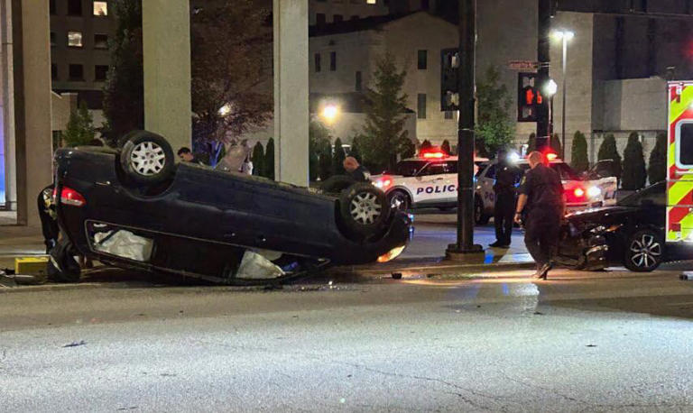 Downtown crash flips van on its top