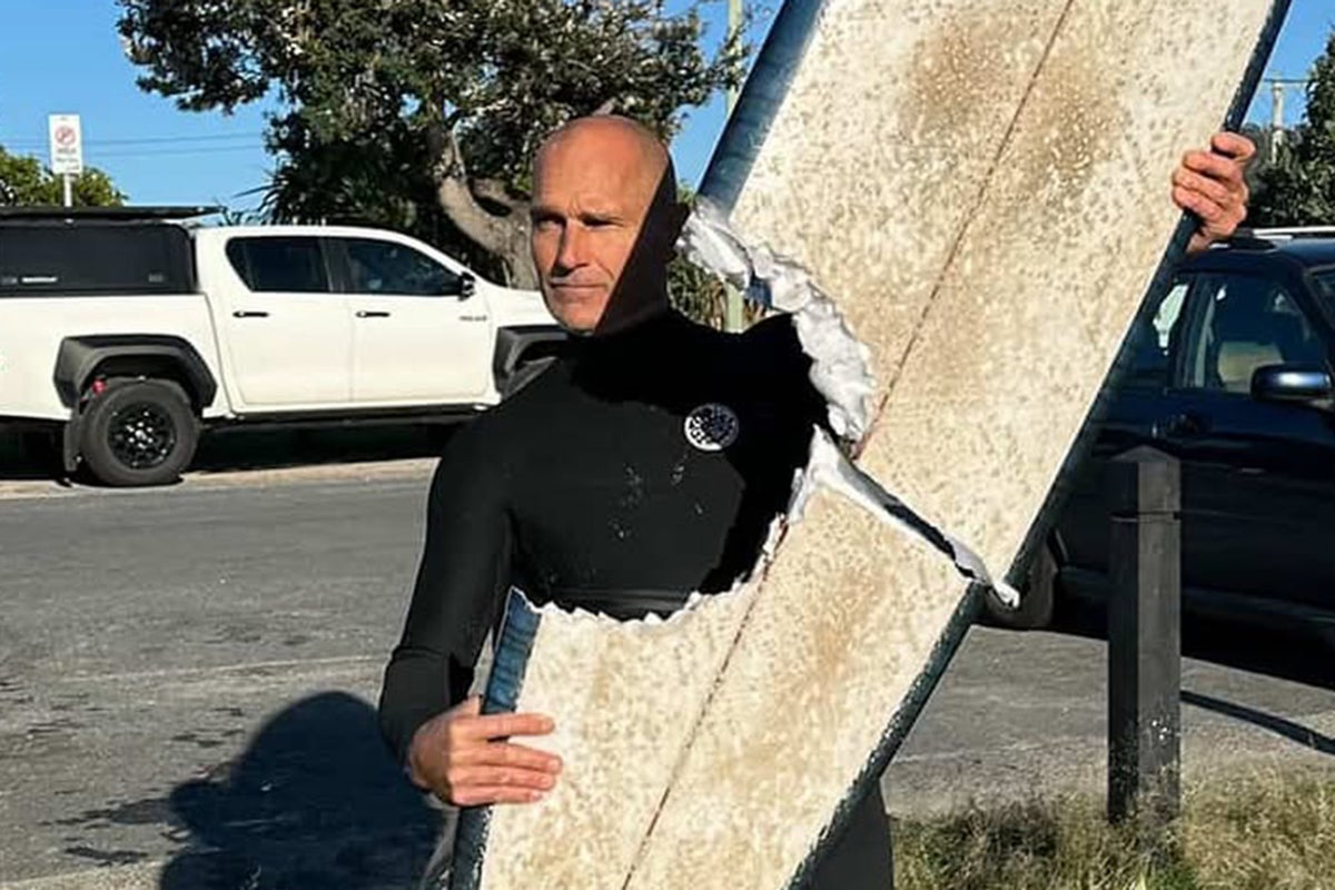Shark tears huge bite-sized chunk out of surfer’s board in terrifying ...