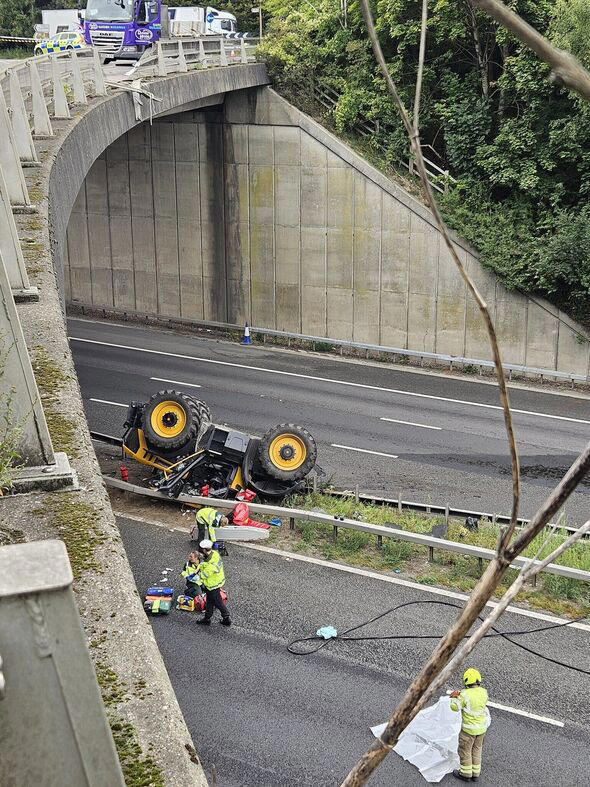 M20 crash horror pictured as tractor lands upside down after falling ...