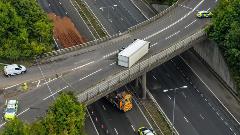 M20 shut as tractor plunges off bridge in Kent