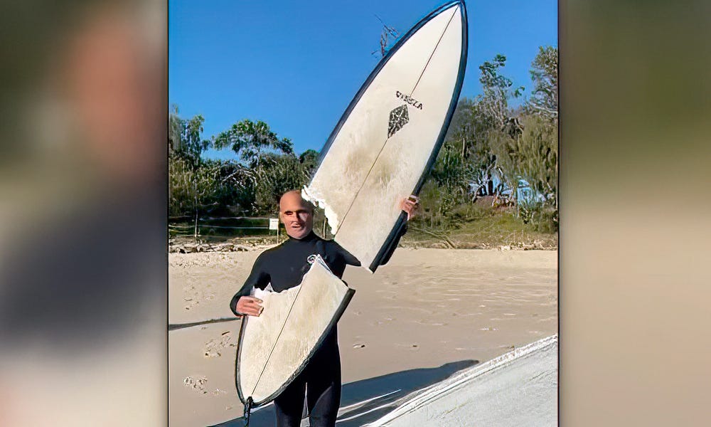 Large shark miraculously spares surfer during 'explosive' attack off ...